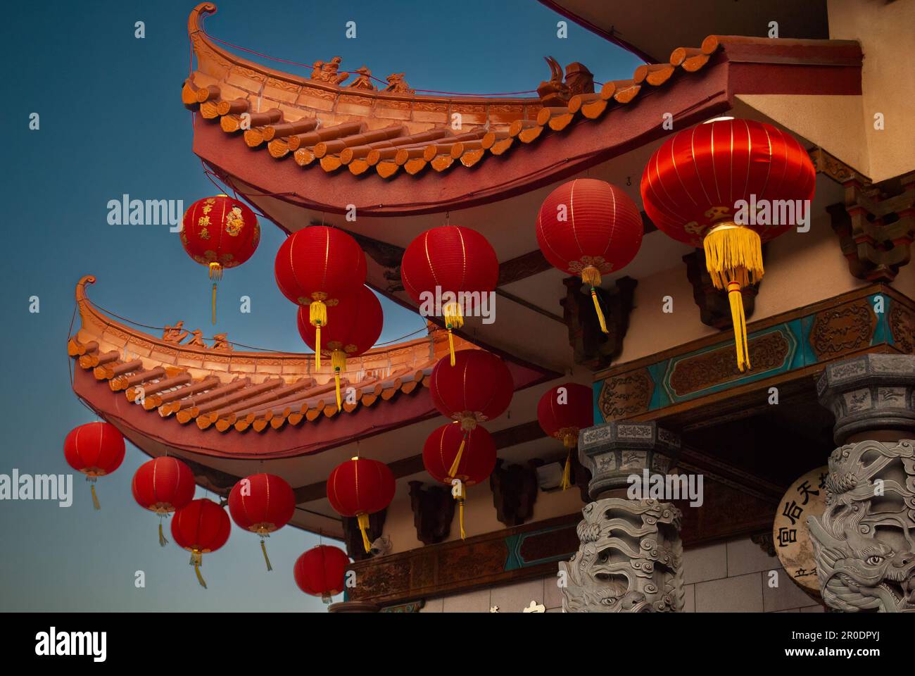 A traditional Chinese architectural design featuring red lanterns and ...