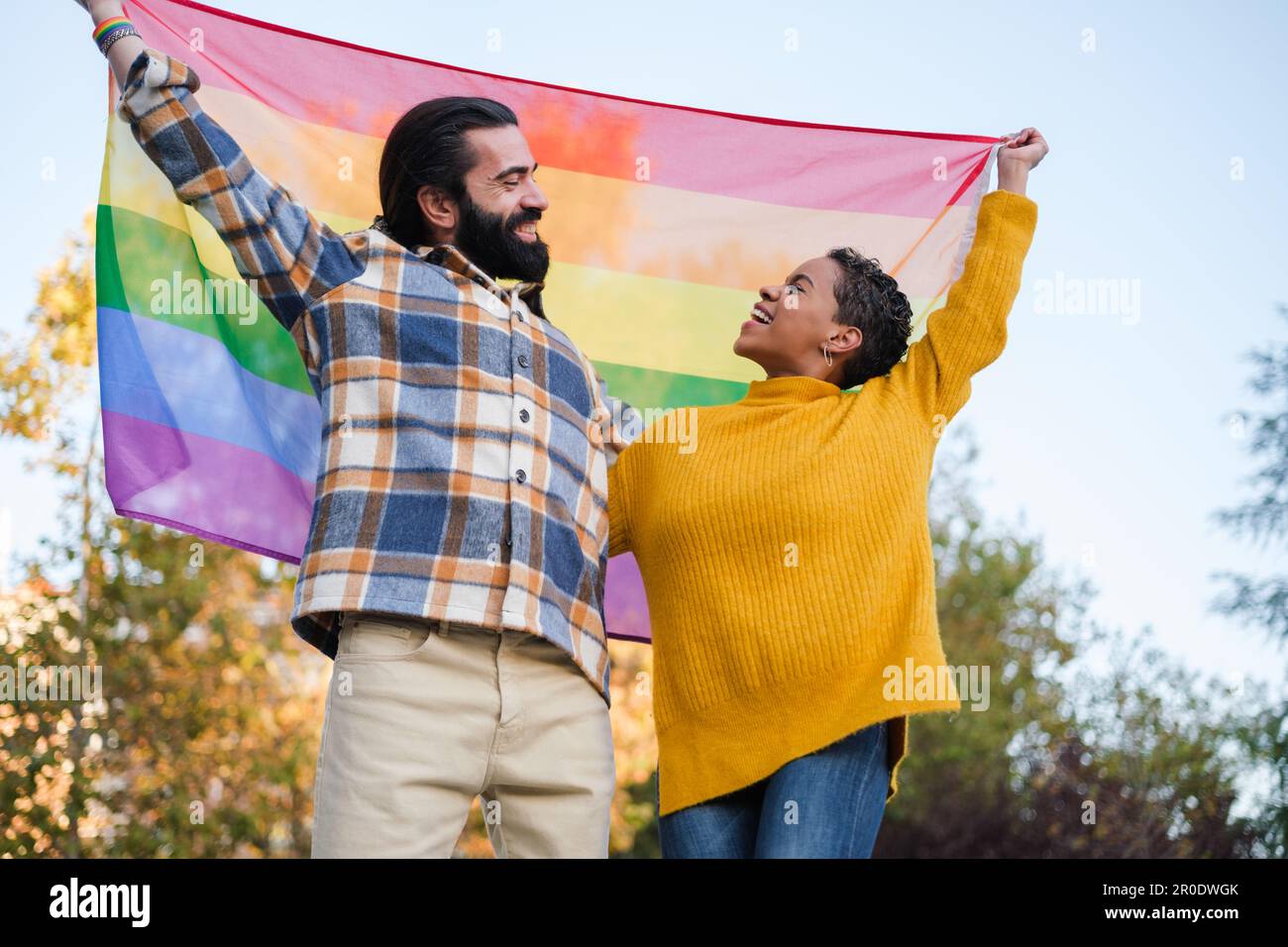Young friends carrying an lgtbi flag and demanding their rights in a ...