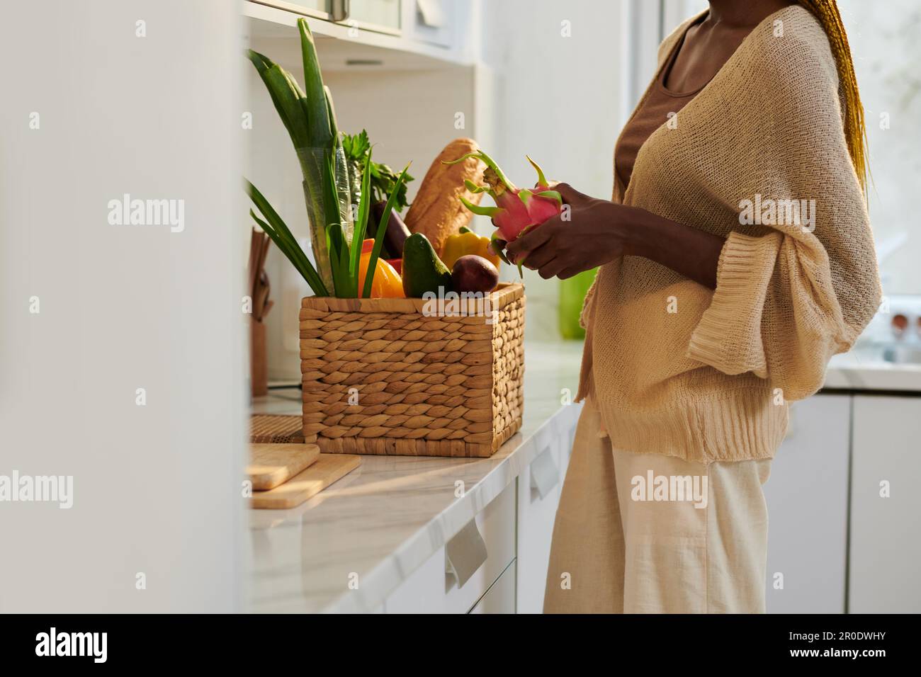 Woman taking out groceries hi-res stock photography and images - Alamy