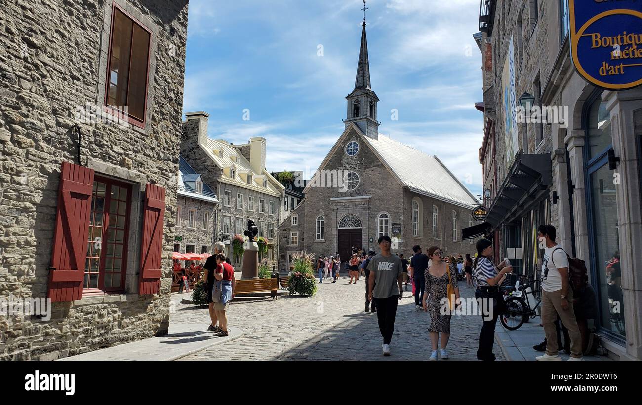 The people walk along a cobblestone street in Place Royale Stock Photo ...