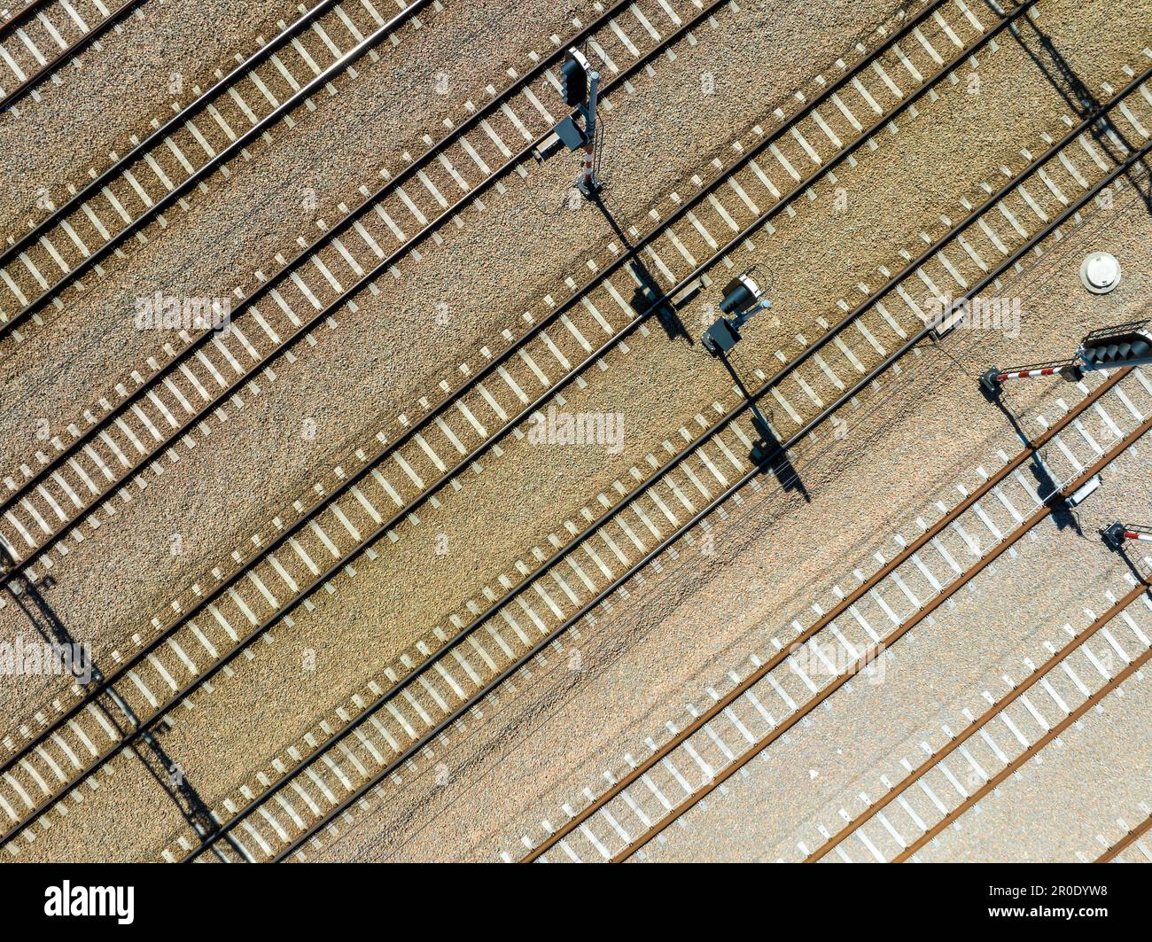 Seven parallel railroad tracks on the gavel with concrete railroad ties ...