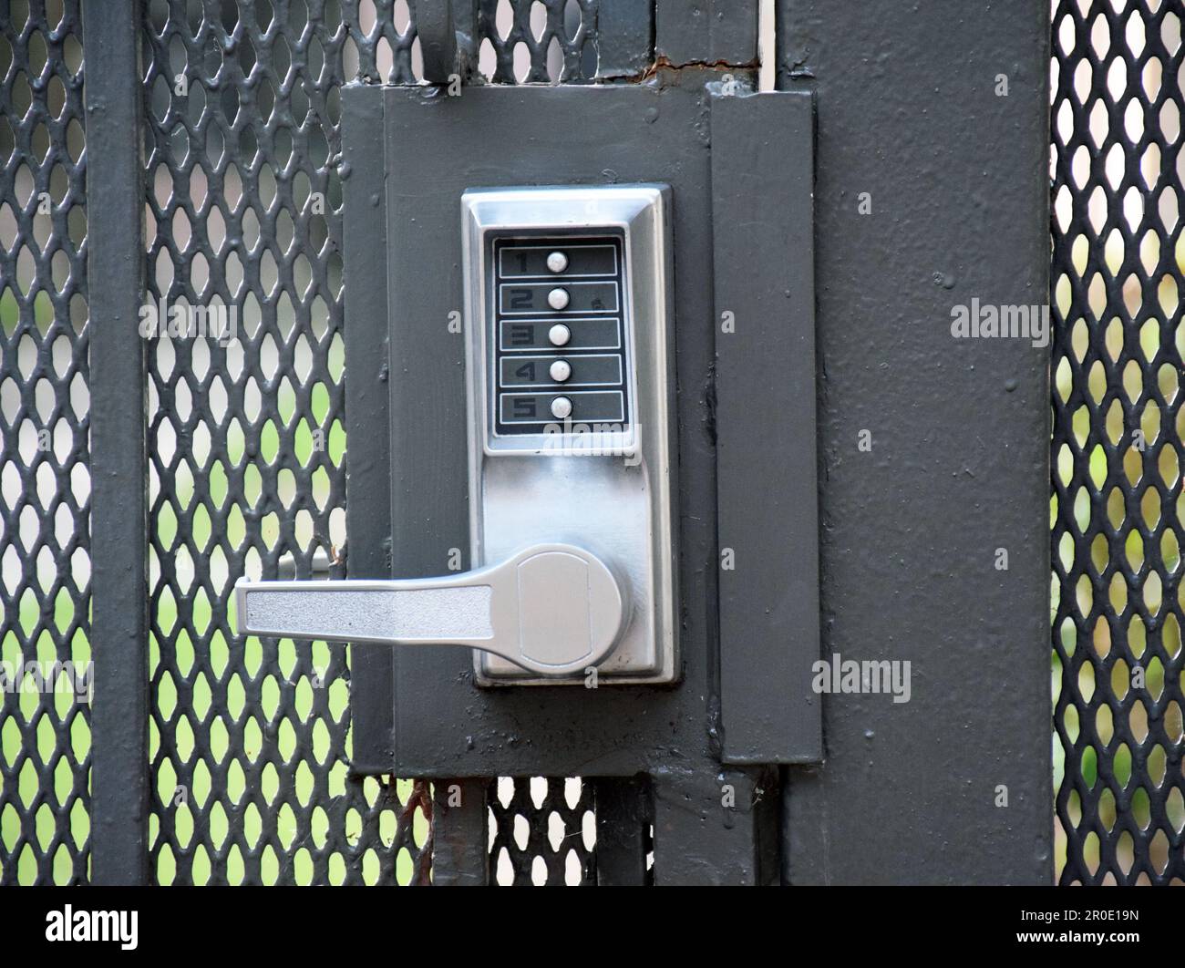 Closeup of a push button security lock at a complex Stock Photo - Alamy