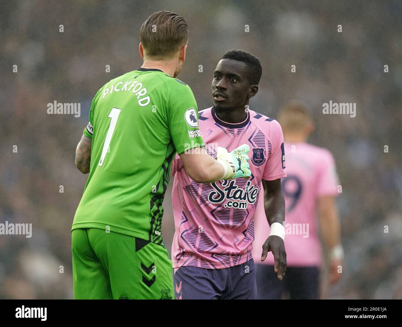 Everton goalkeeper Jordan Pickford (left) and Idrissa Gueye exchange ...