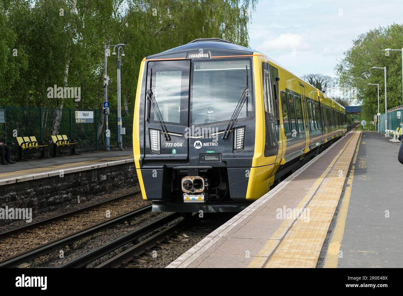A new train Class 777 for Merseyrail service arrives at Maghull Station ...