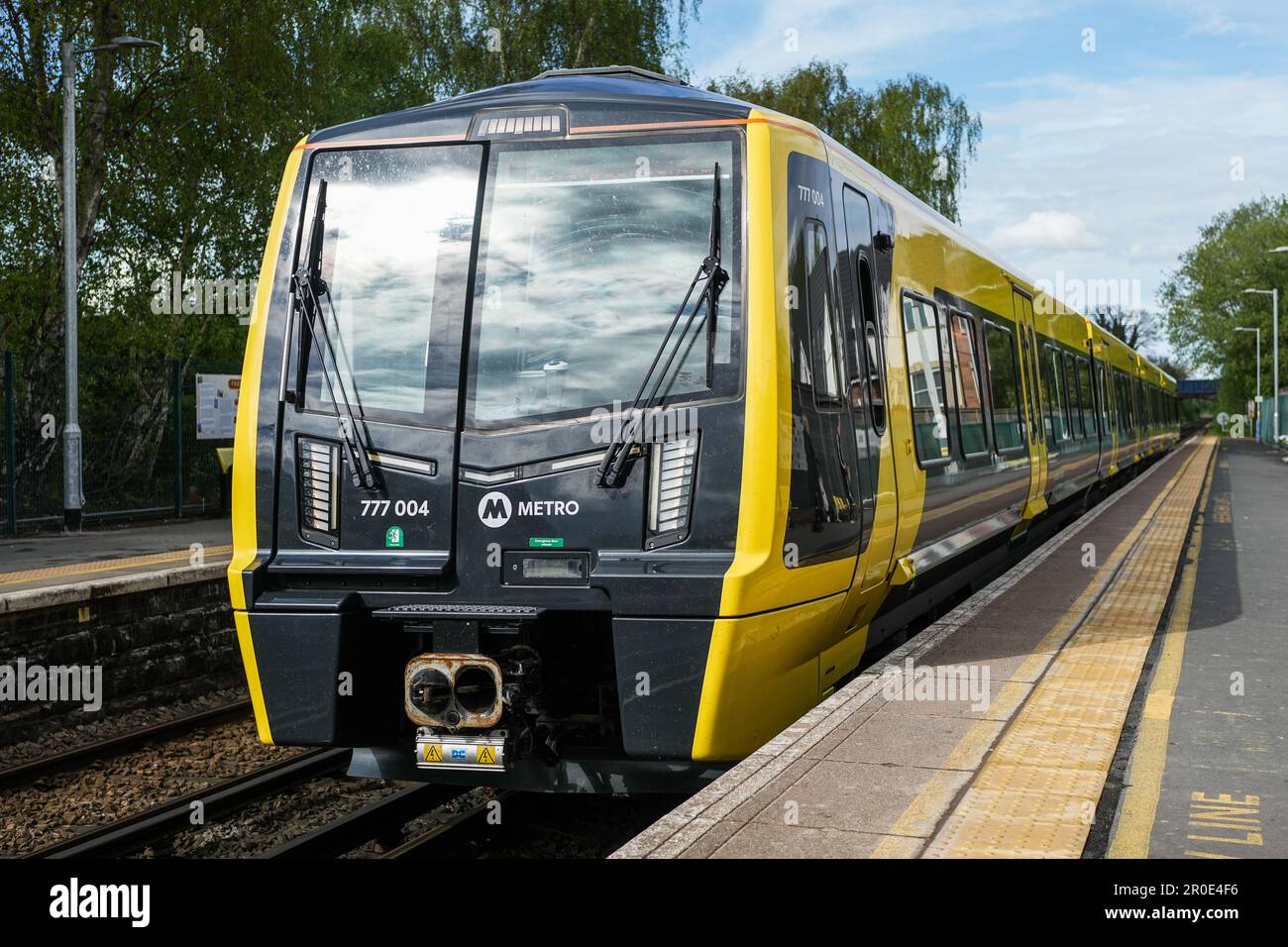 A new train Class 777 for Merseyrail service arrives at Maghull Station ...