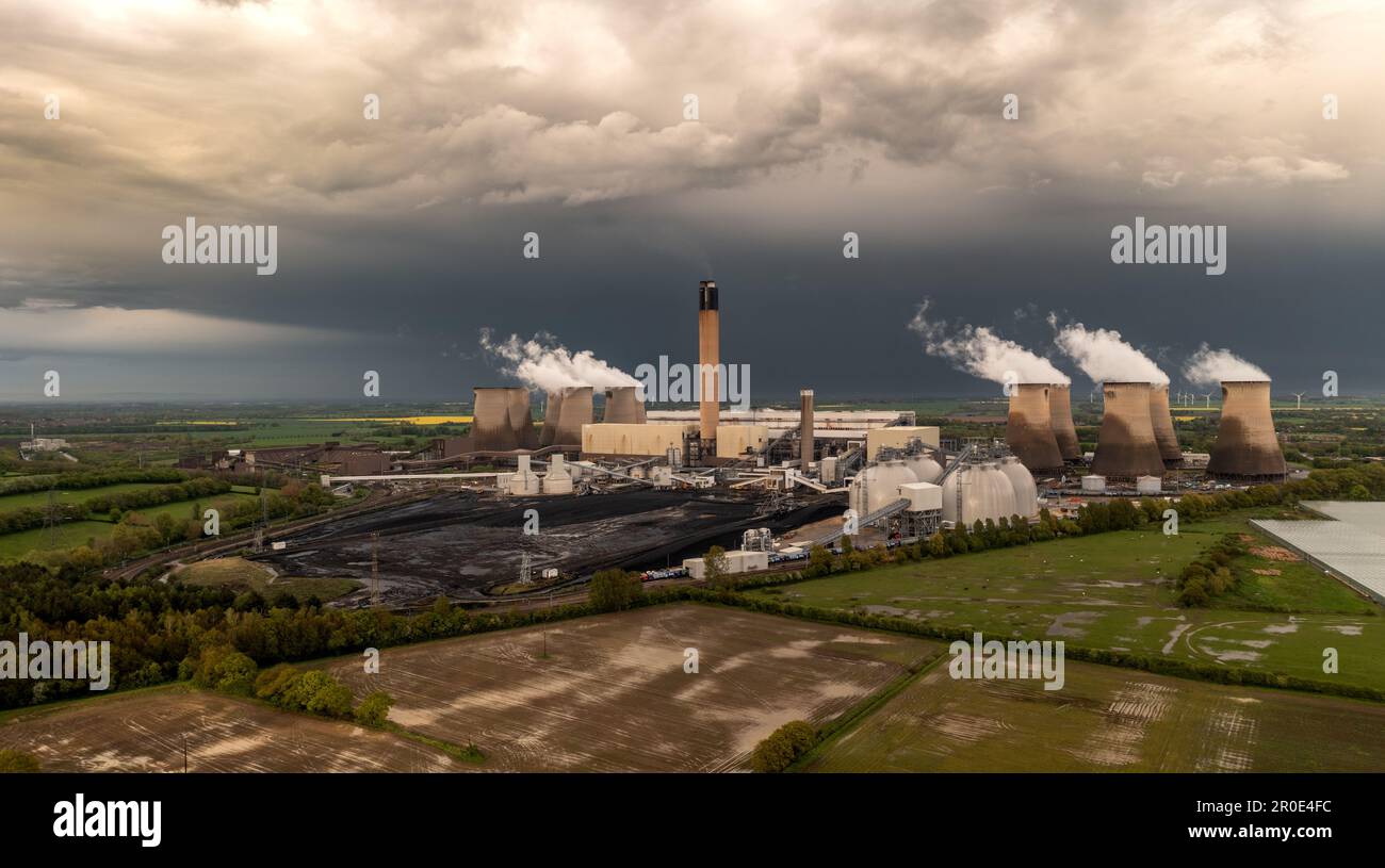Aerial landscape view of Drax Power Station in North Yorkshire with dirty smoking chimneys and ...