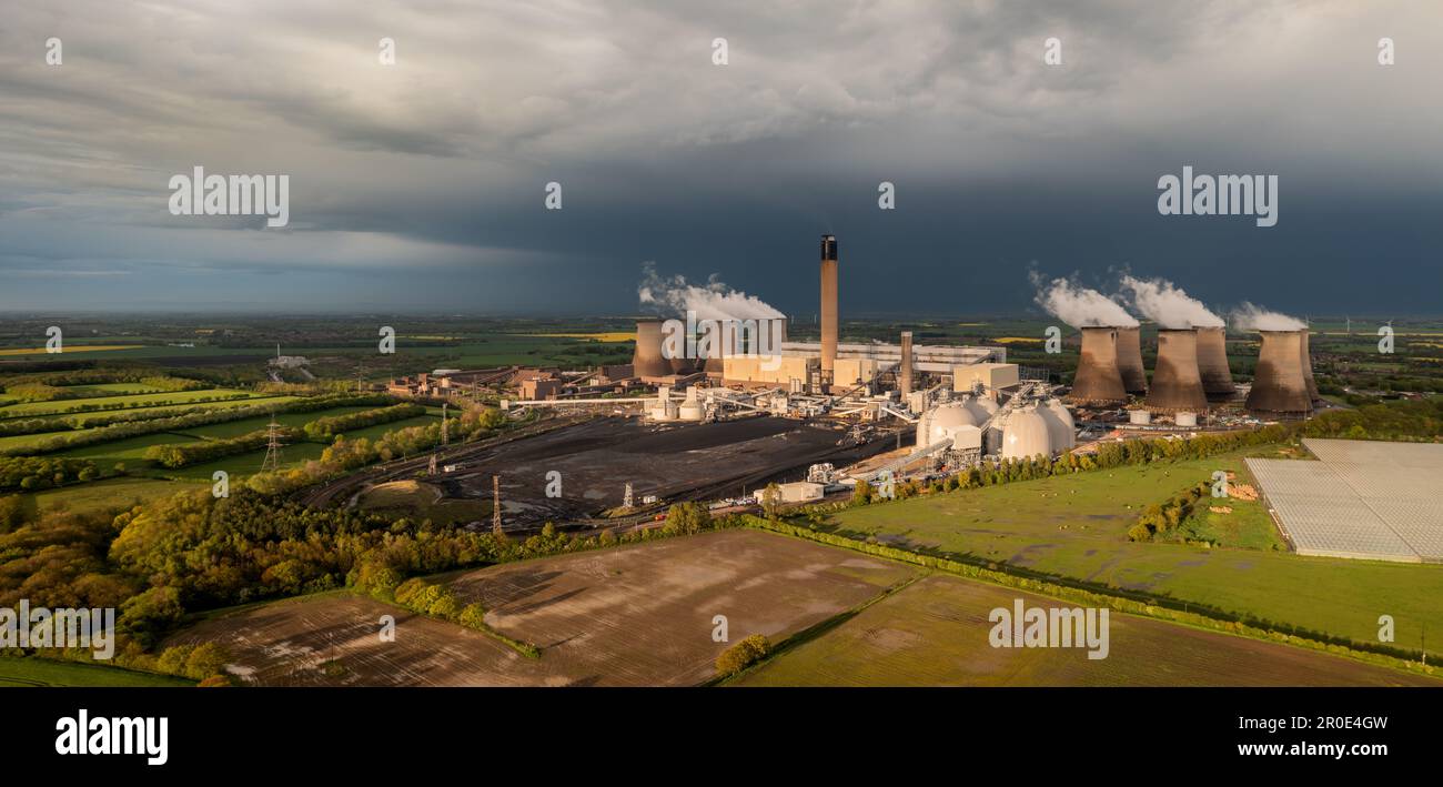 Aerial landscape view of Drax Power Station in North Yorkshire with dirty smoking chimneys and ...