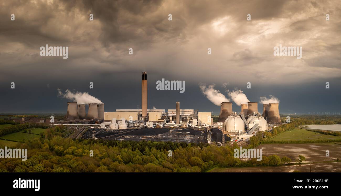 Aerial landscape view of Drax Power Station in North Yorkshire with dirty smoking chimneys and ...