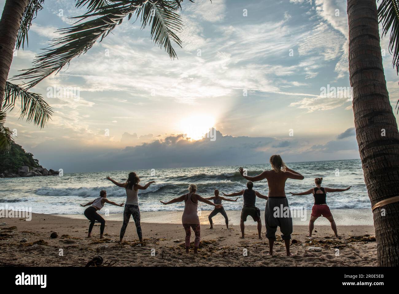 A yoga class on the beach on the island of Koh Phangan, Thailand Stock ...