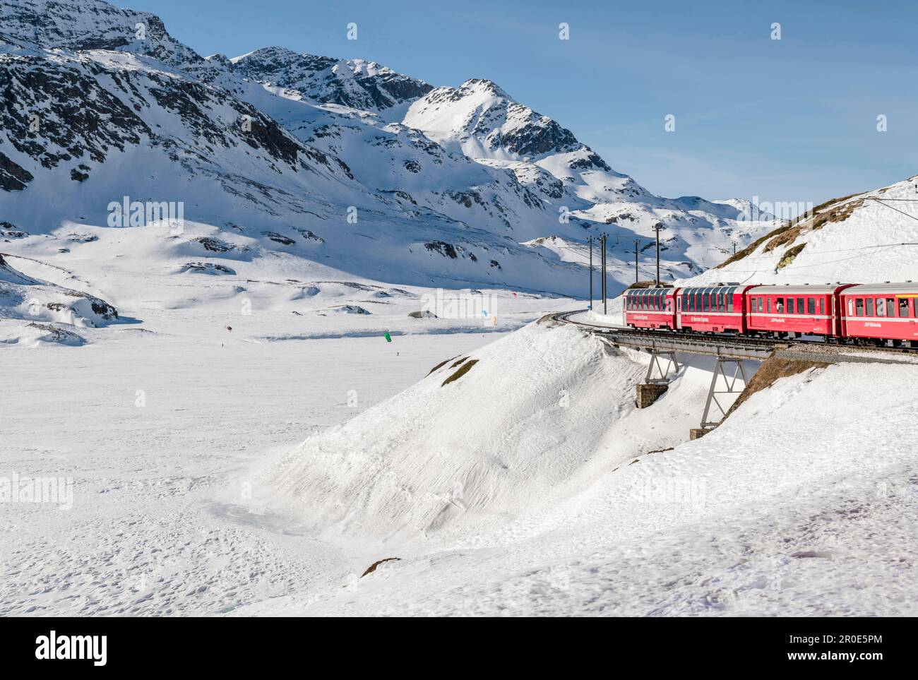 Switzerland, Engadin, Pontresina: railway with Bernina Express at Lago ...