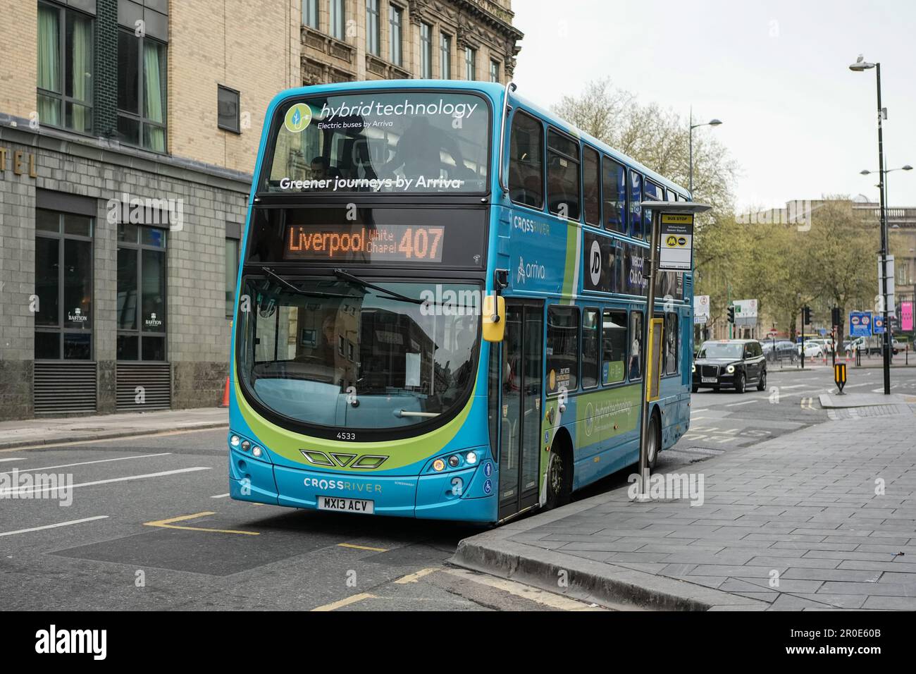 An Arriva bus parked at a bus stop in Liverpool Stock Photo - Alamy
