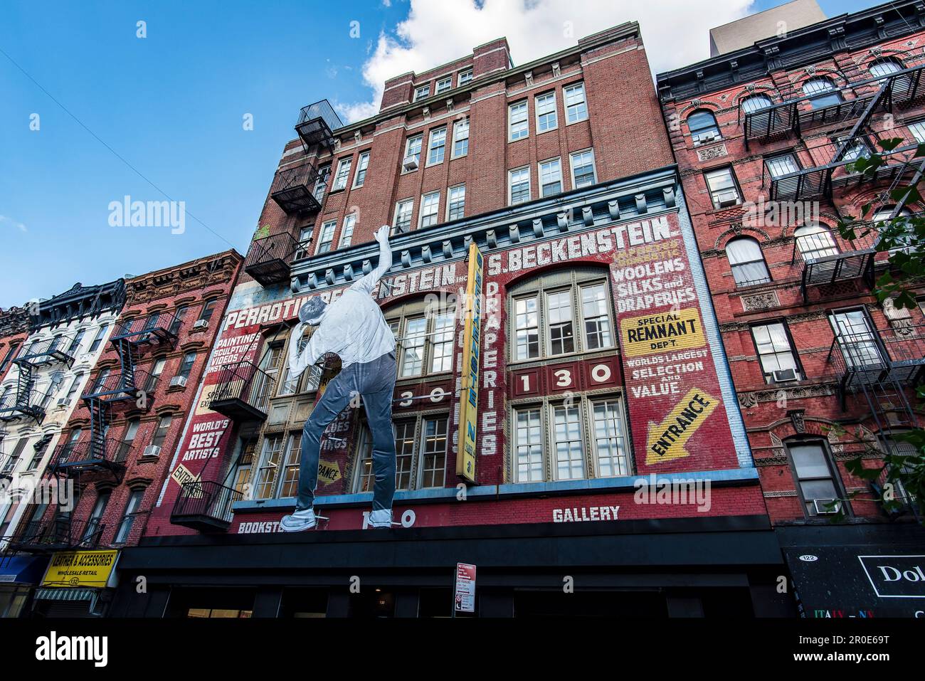 A photo installation of 'JR' on the facade of the former fabric shop ...