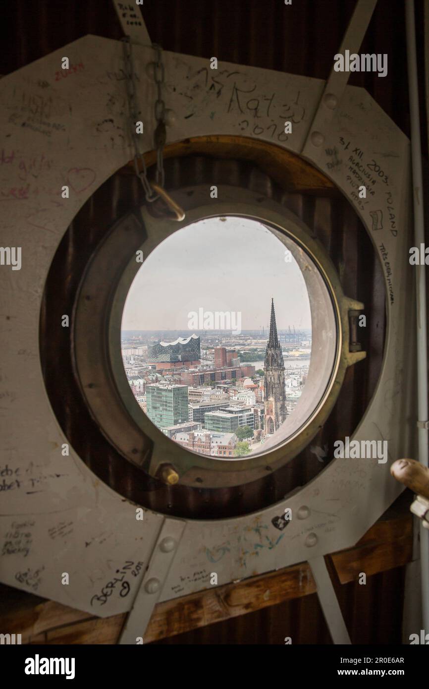 The church of St. Petri seen through a bulls-eye window, Hamburg ...