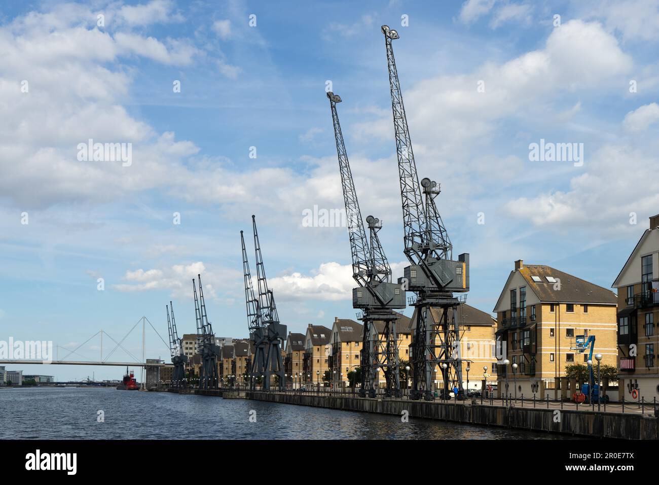 Old Dockside Cranes alongside a Waterfront Development in London Stock ...