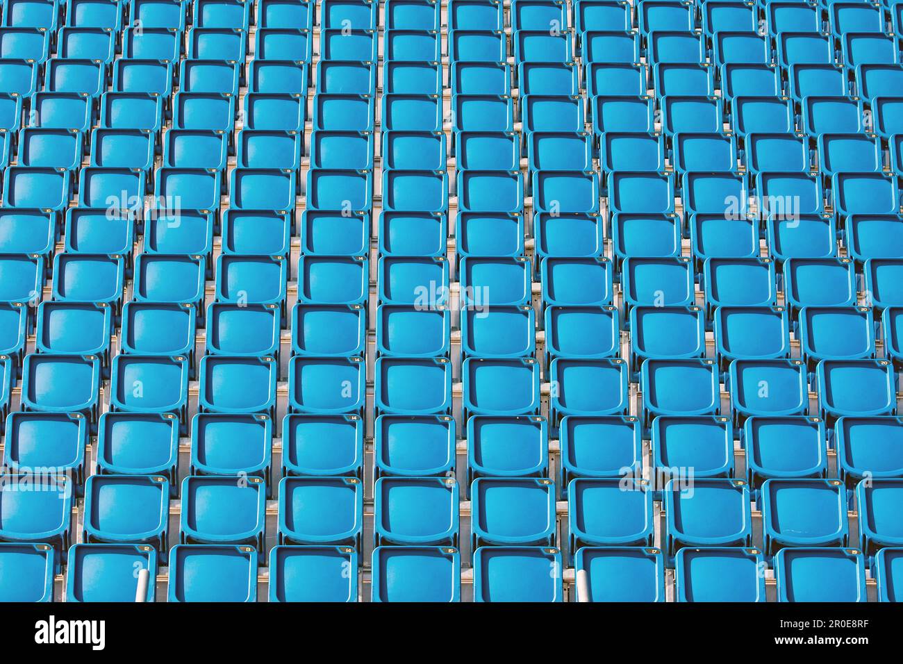 Blue folding seats in a football stadium Stock Photo - Alamy
