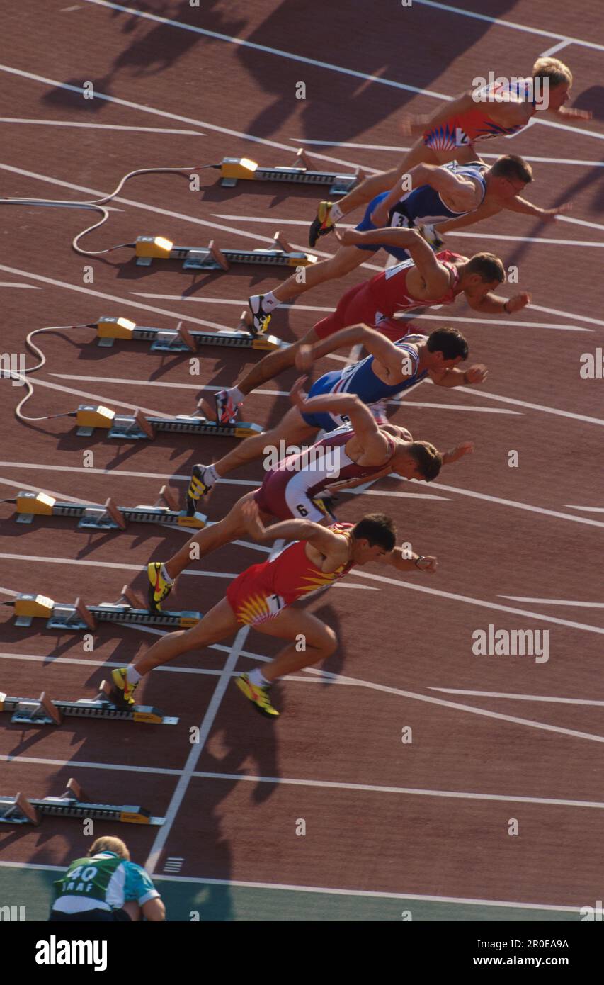100 meter runners starting Stock Photo - Alamy