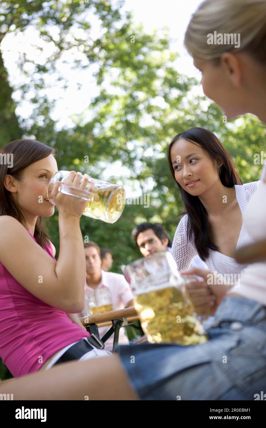 Three girls drinking beer hi-res stock photography and images - Alamy