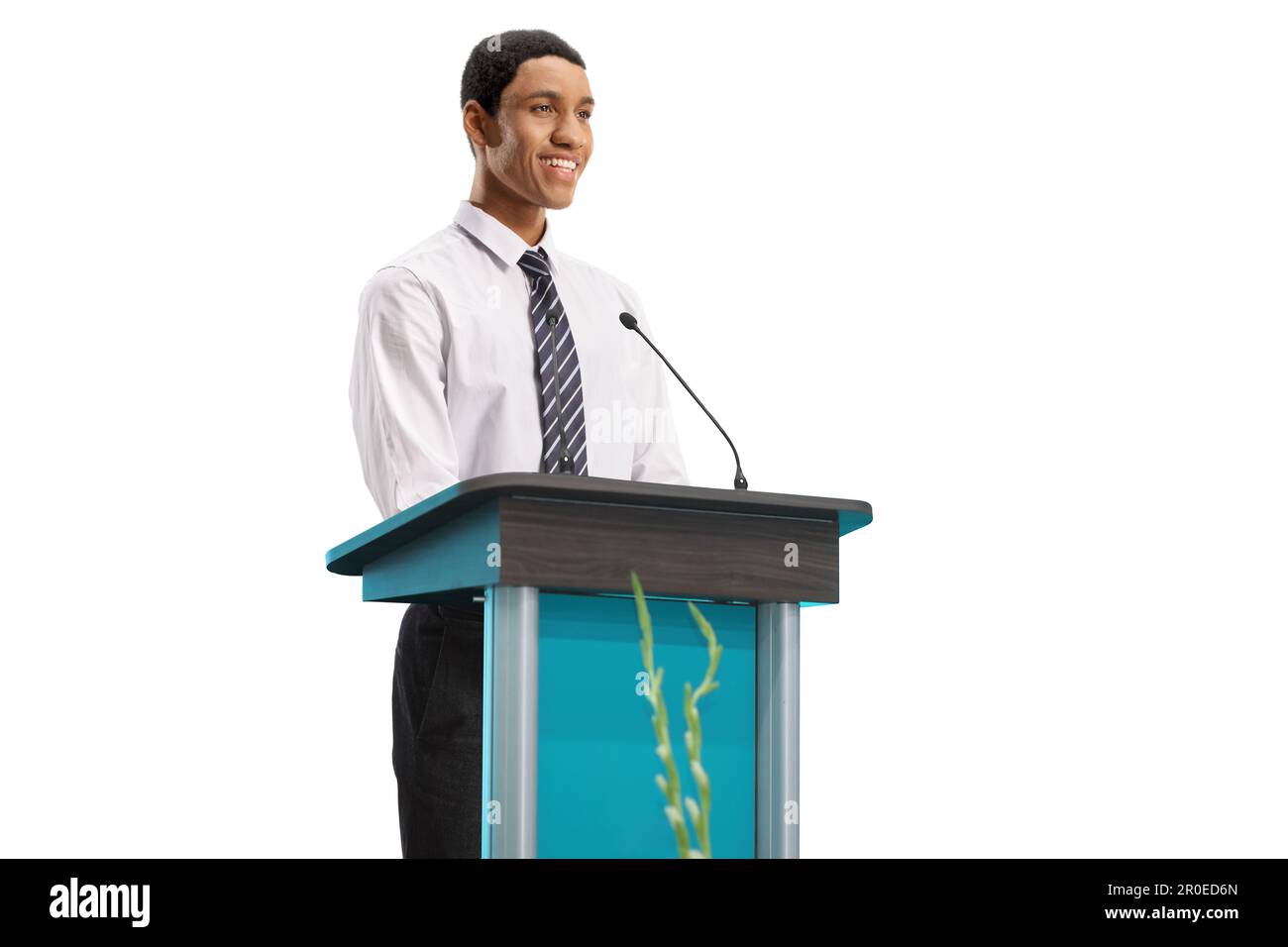 Young african american man standing behind a podium and smiling ...