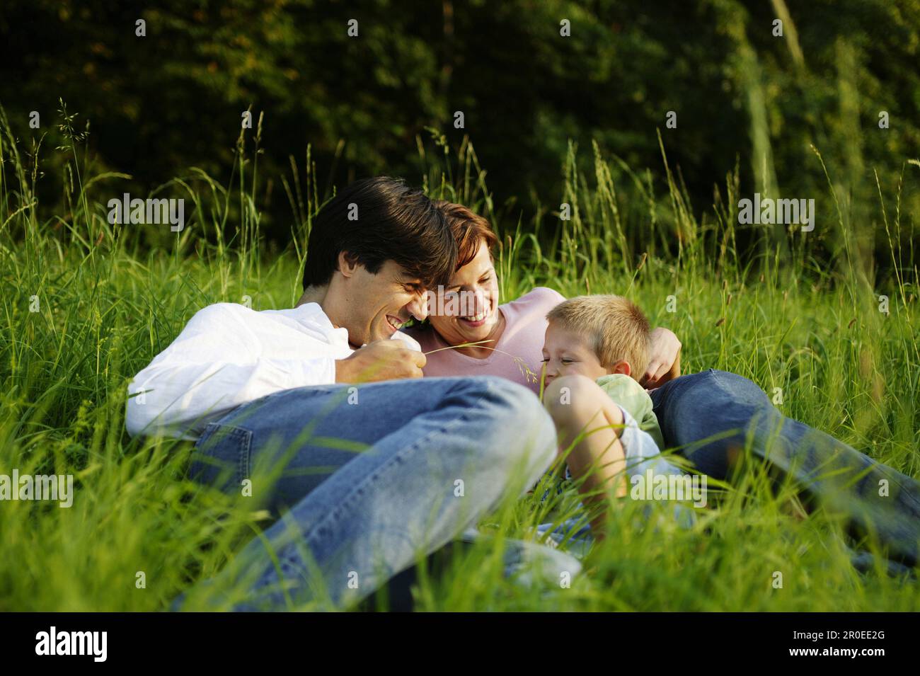 Family in nature, Family in nature, Family sitting in green meadow ...