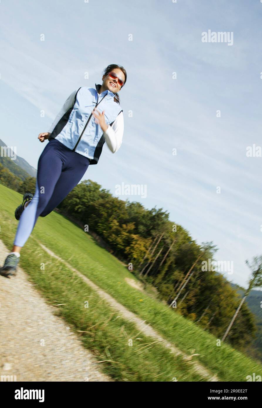 Low angle shot woman jogging hi-res stock photography and images - Alamy