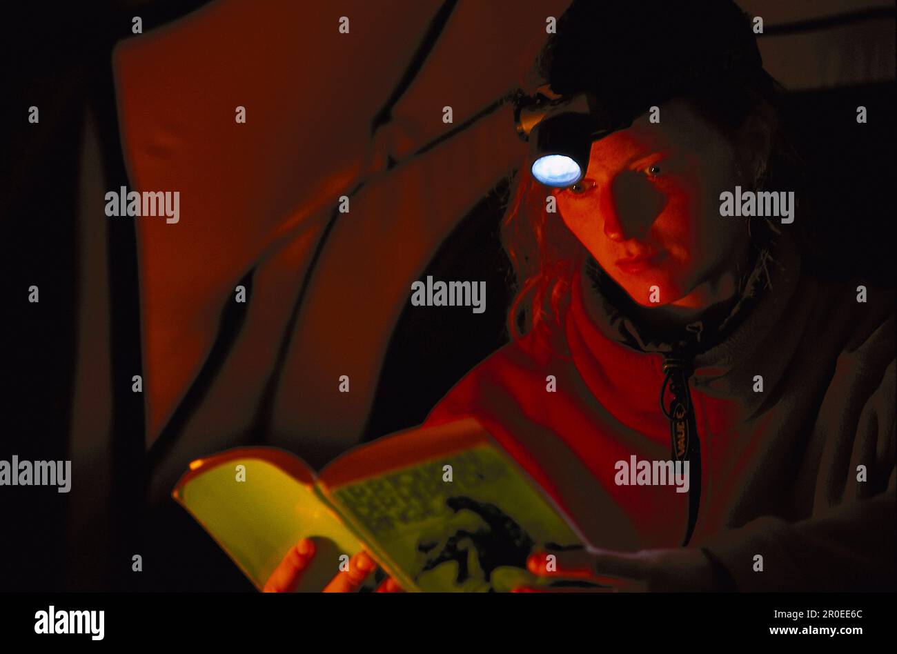 Woman reading book flashlight hi-res stock photography and images - Alamy