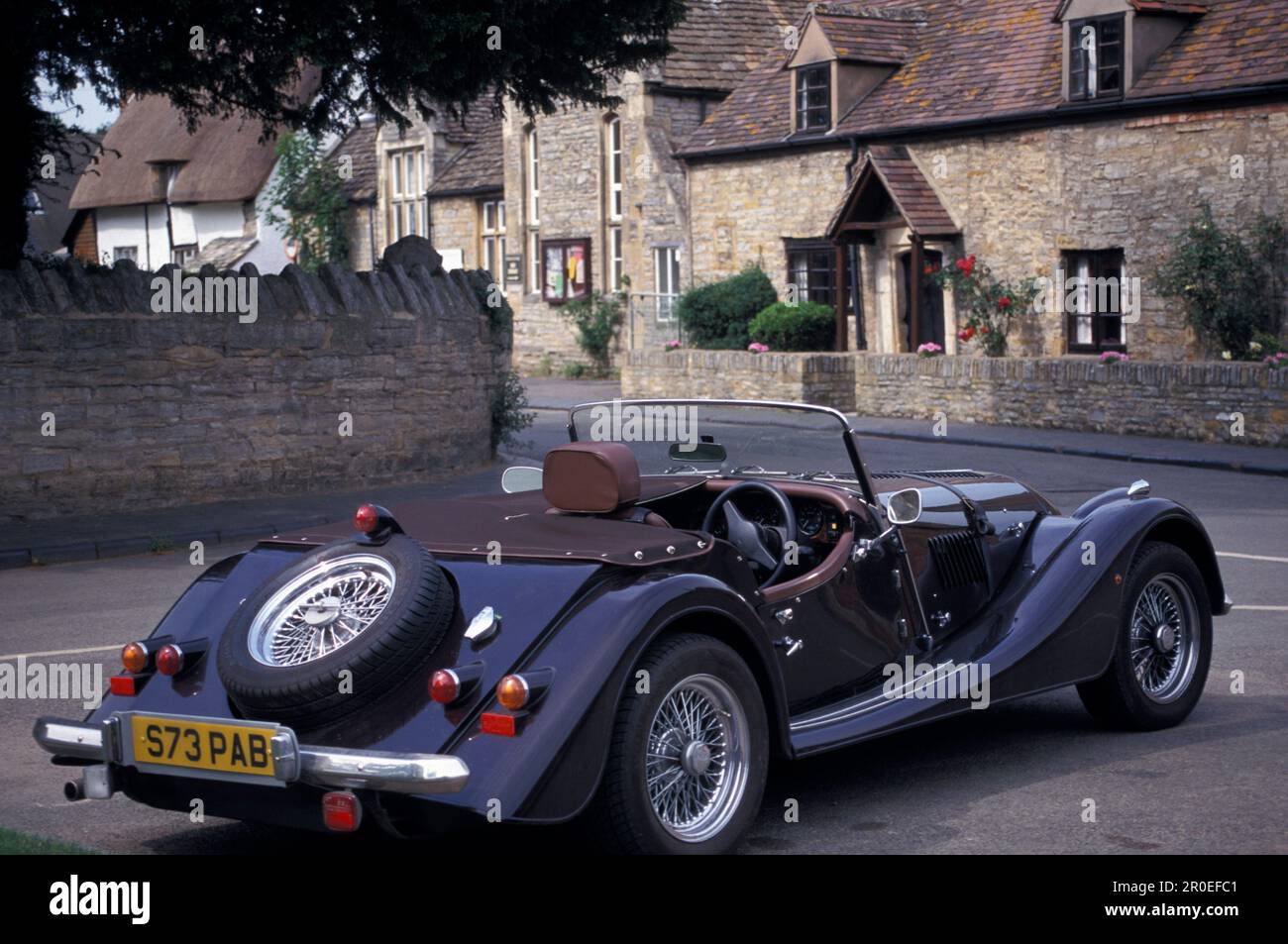Vintage car in front of houses at medieval village of Bretforton ...