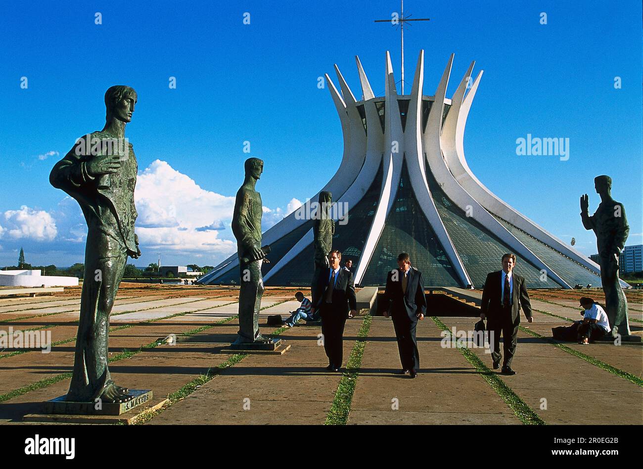 People and statues in front of the Metropolitana Cathedral, Brasilia ...