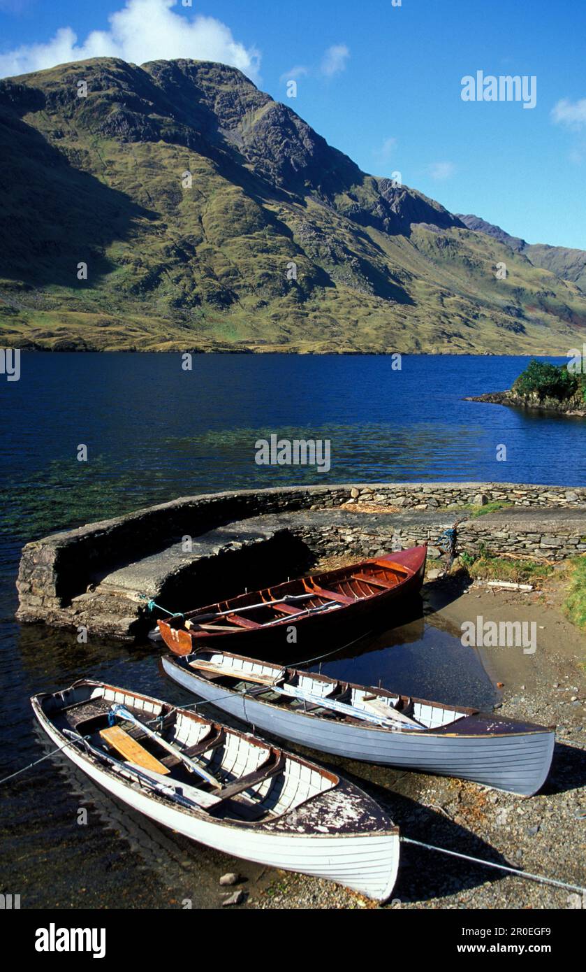 Boats on the banks of Doo Lough, Delphi, County Mayo, Ireland, Europe ...