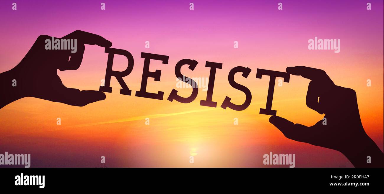 Resist - human hands holding black silhouette word Stock Photo - Alamy
