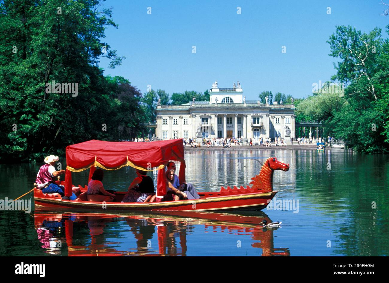 Boat on a lake at Lazienki Park and Palais Belvedere in the background ...