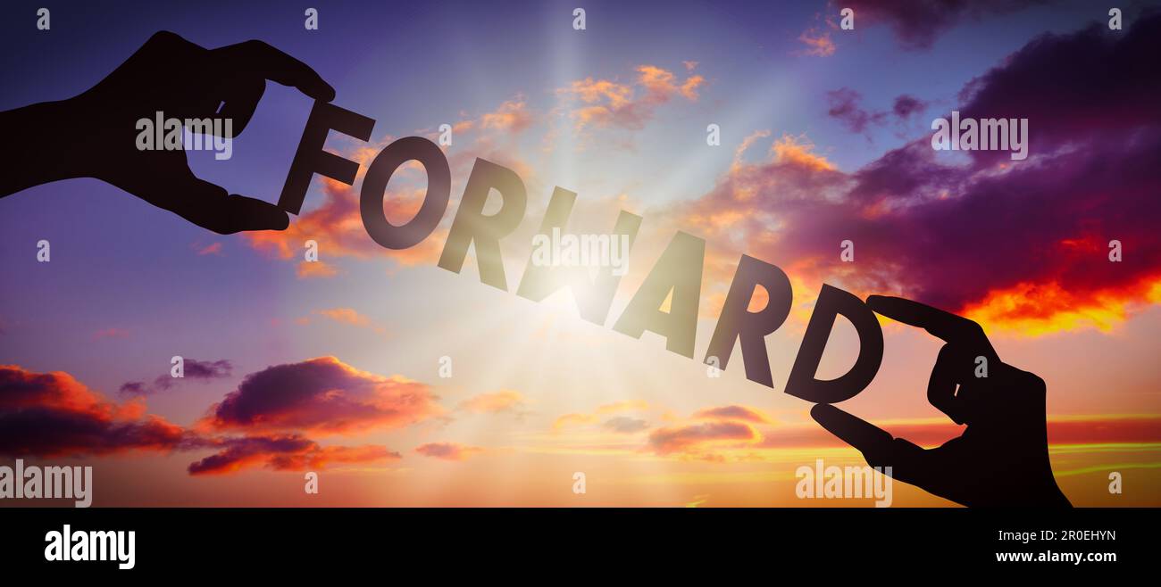 Forward - human hands holding black silhouette word Stock Photo - Alamy