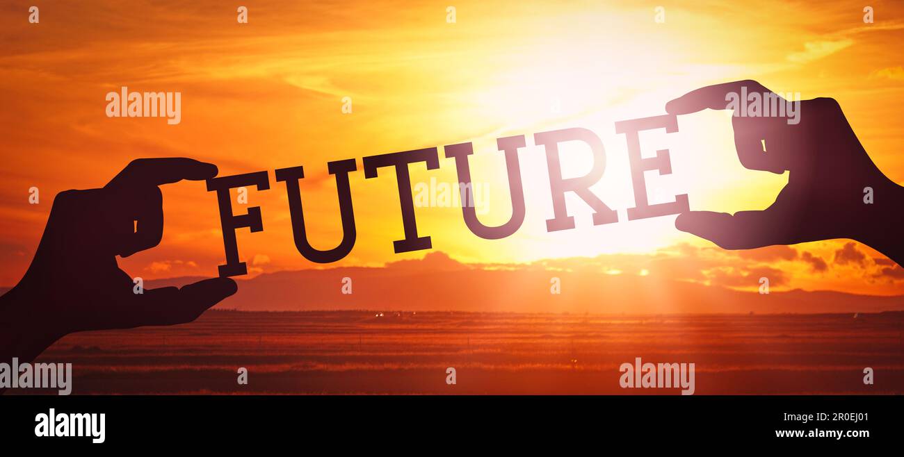 Future - human hands holding black silhouette word Stock Photo - Alamy