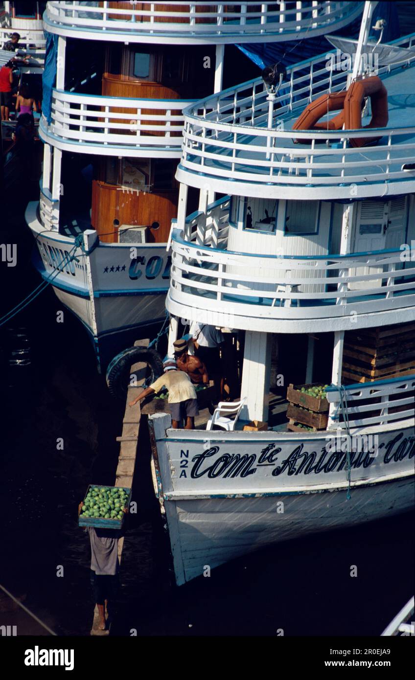 Loading Amazon river boats, in the floating harbour of Manaus, Amazonia ...