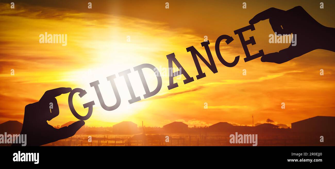 Guidance - human hands holding black silhouette word Stock Photo - Alamy