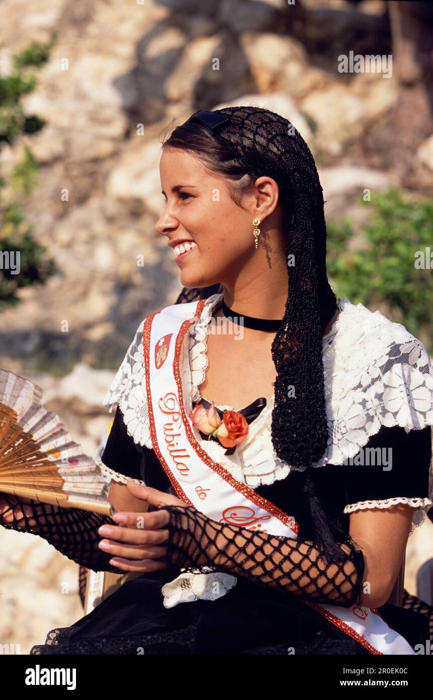 Young women in traditional dress representing different villages at the ...