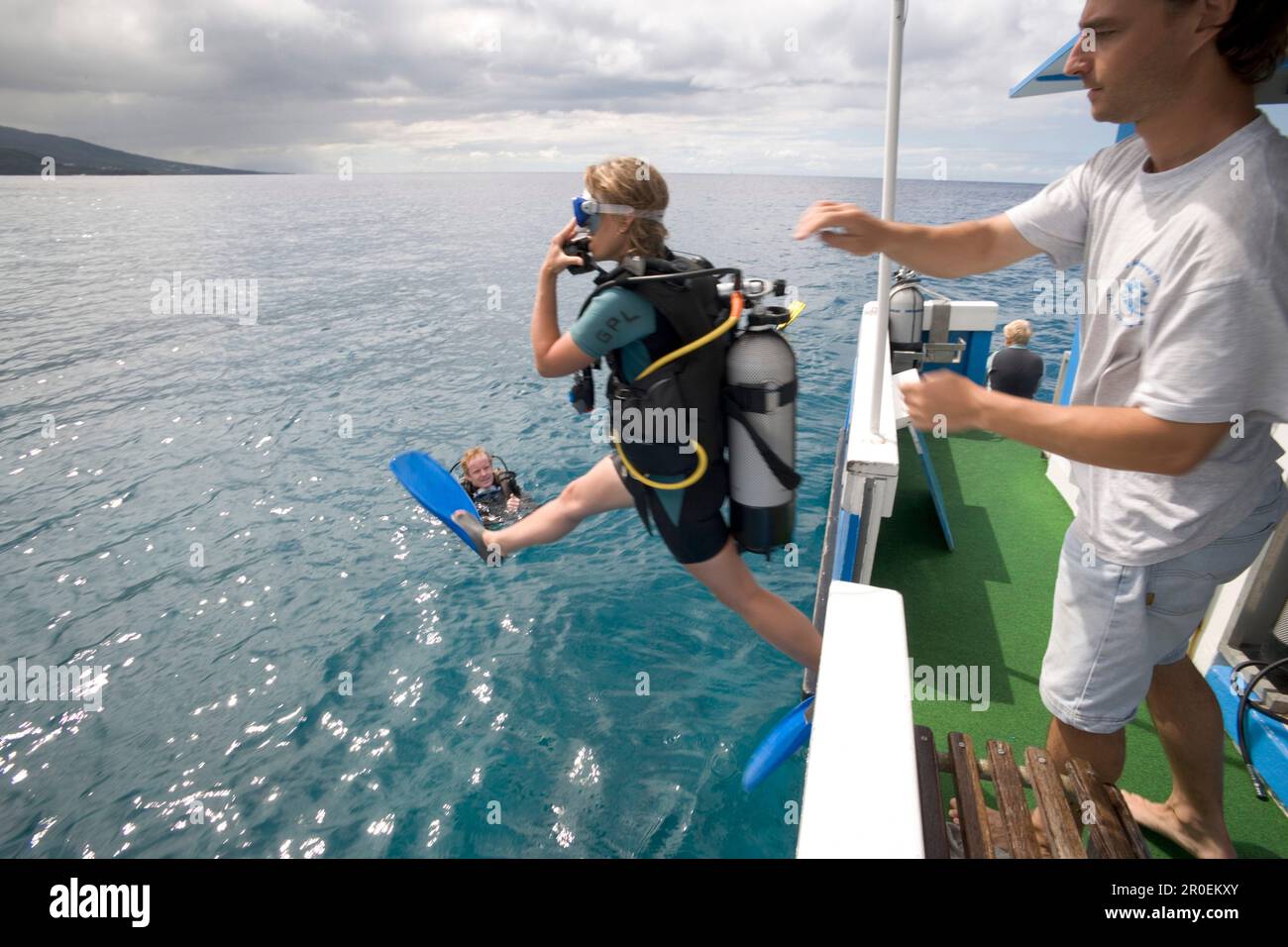 Diver jumping off the boat of Les Heures Saines Diving School ...