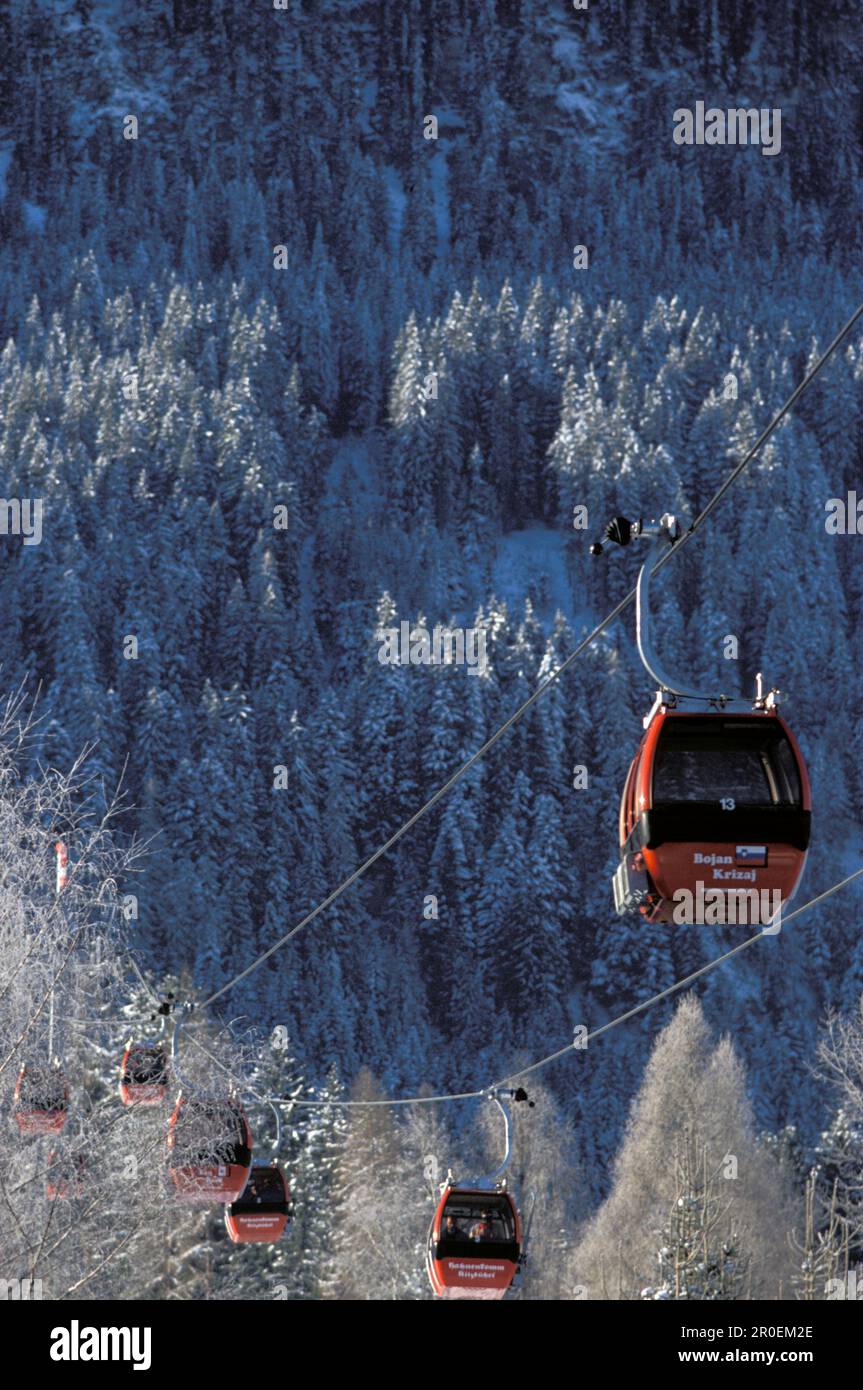 Hahnenkammbahn, cable car in front of snowy forest, Kitzbuehel, Tyrol ...
