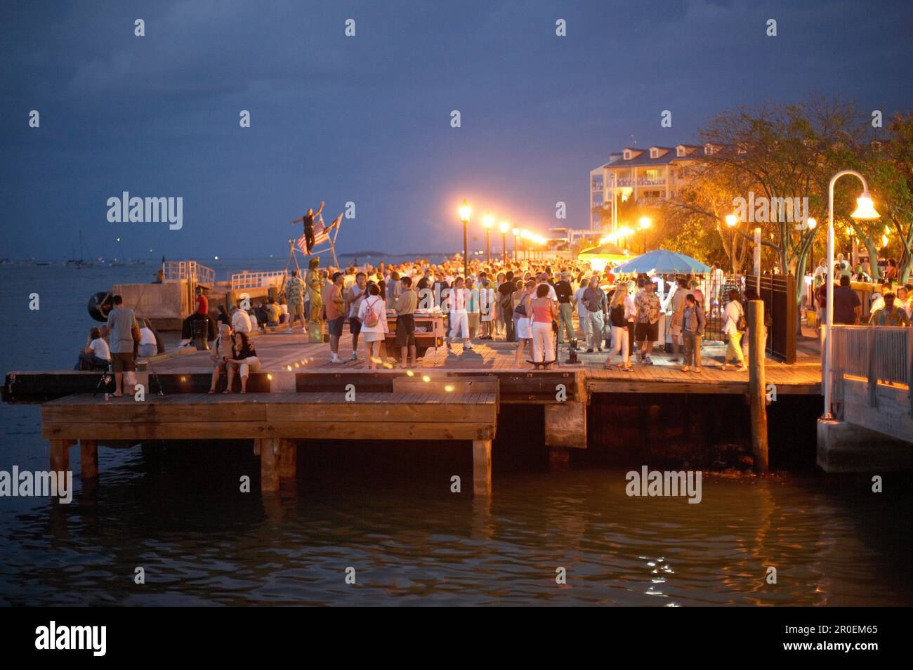 Pier filled with spectators at the daily sunset ce, Mallory Square, Key ...