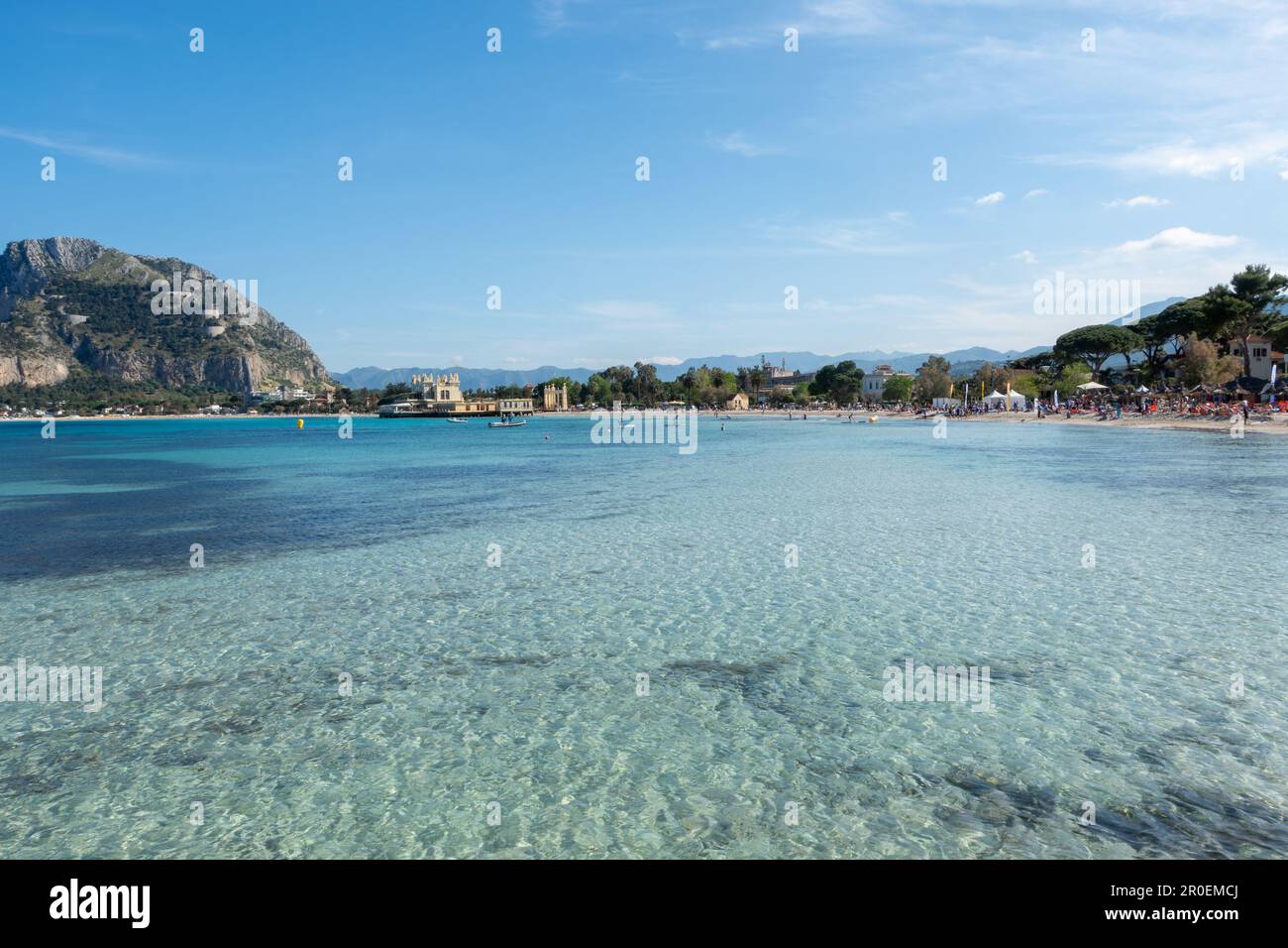 Sicily, Mondello bay and beach with tourists in the summer sun and ...