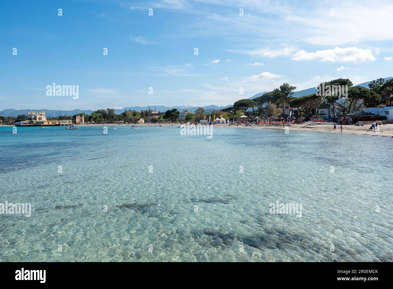 Sicily, Mondello bay and beach with tourists in the summer sun and ...