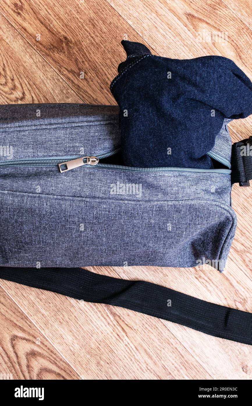 Clothes sticking out of a travel bag close up Stock Photo - Alamy
