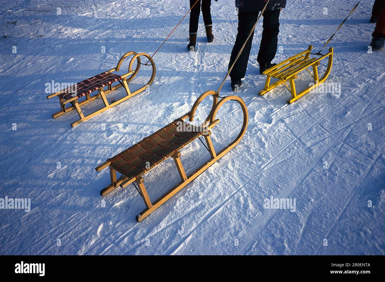 People throwing sledges Stock Photo - Alamy