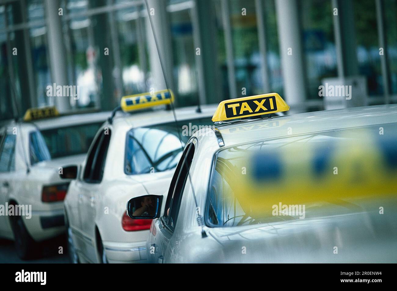 Line of taxis at airport Stock Photo - Alamy