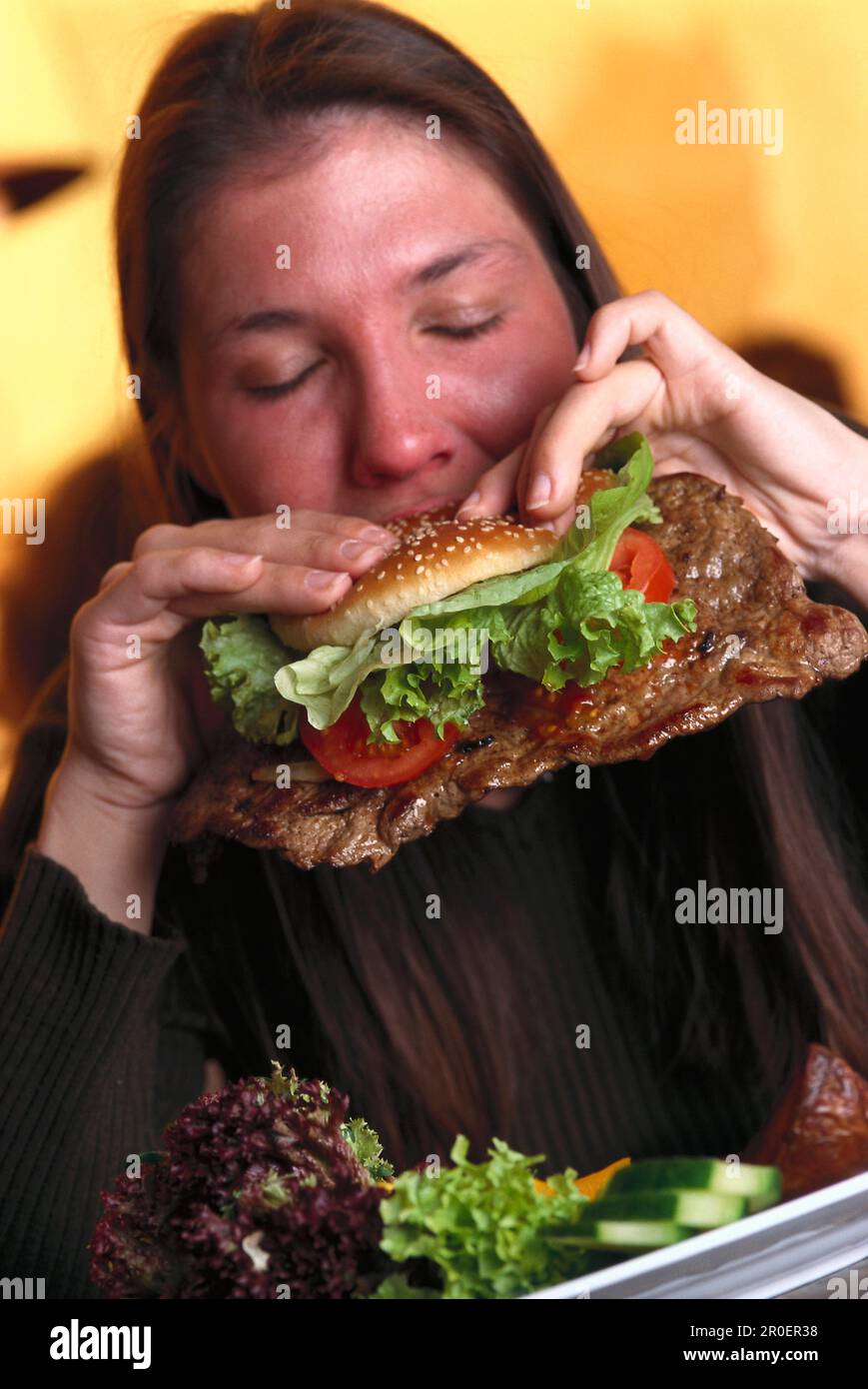 Woman enjoying a Big Steak Sandwich in the Australian Restaurant ...