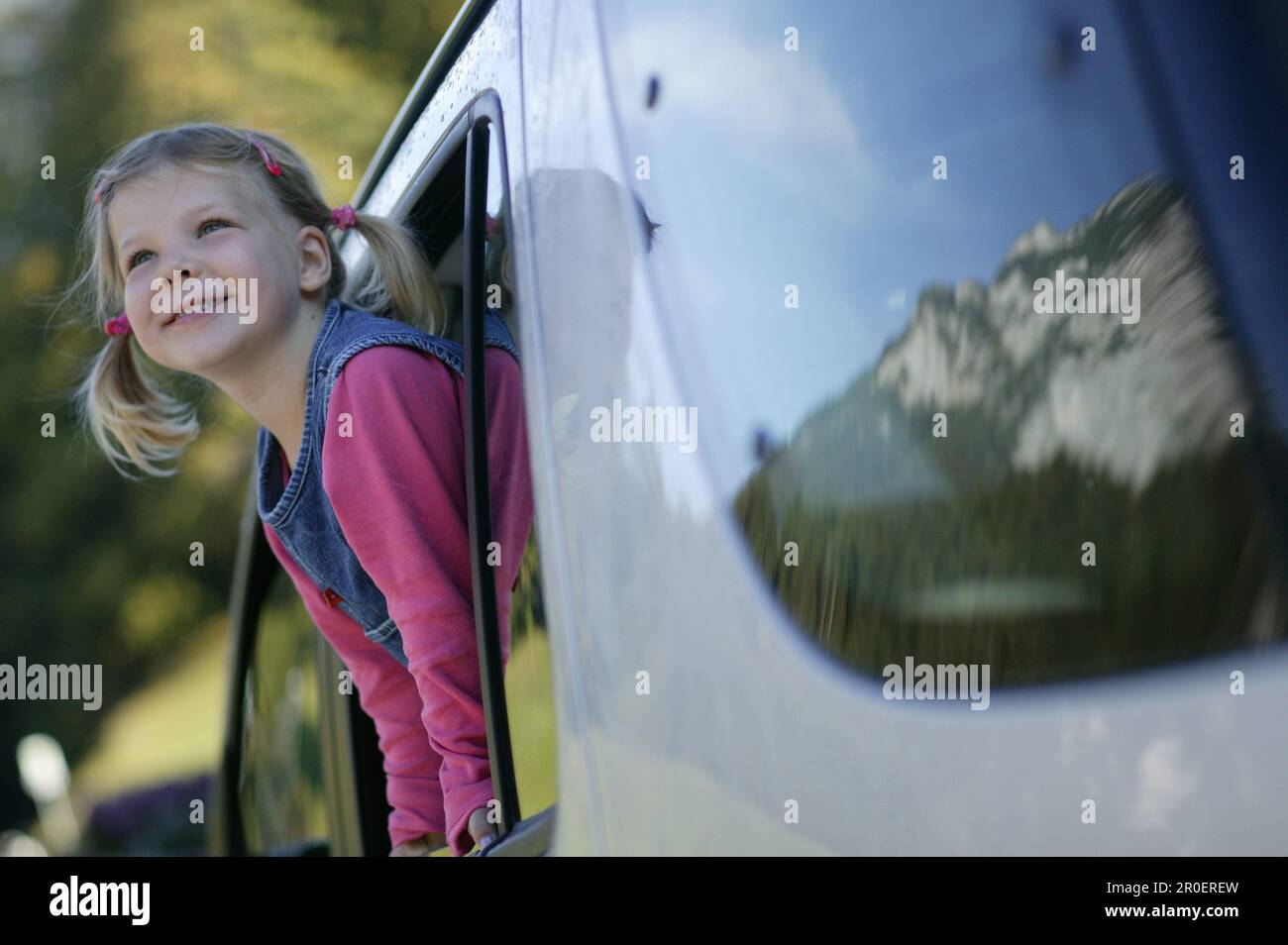 Young girl looking out the car window, Young girl looking out of the ...