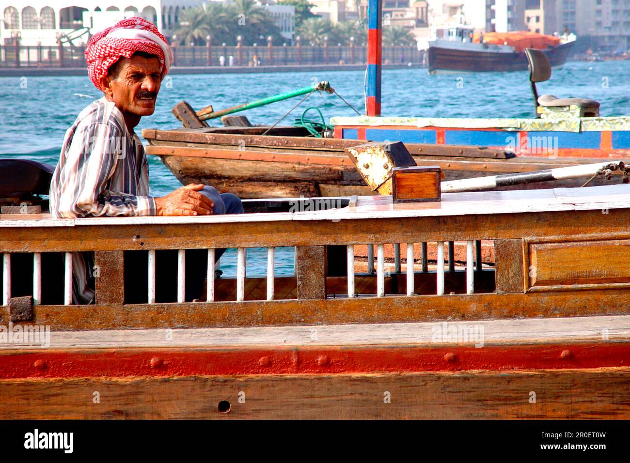 Arab in a traditional boat, Abra, Dubai Creek, Dubai, UAE, United Arab ...