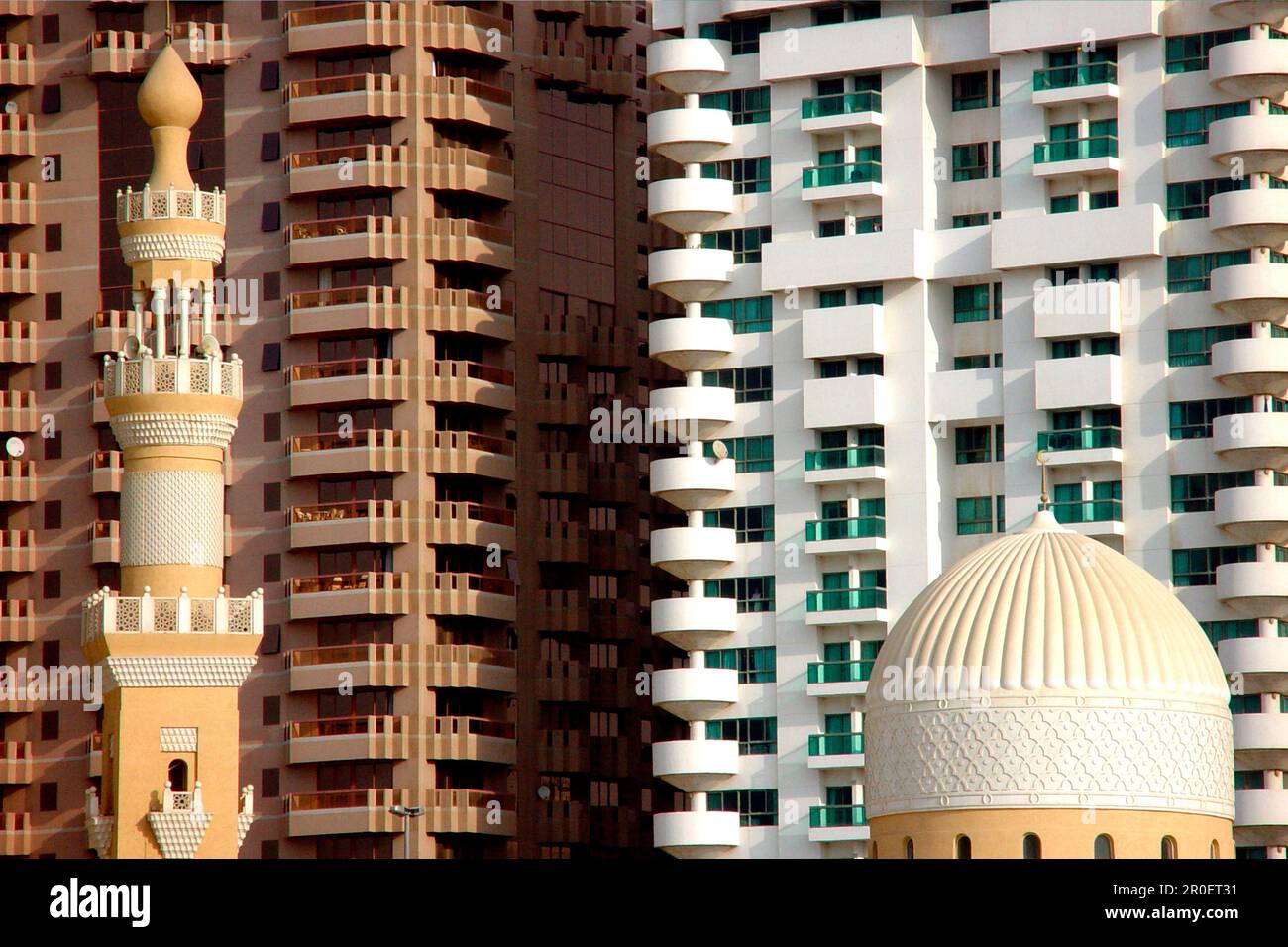 Minaret of a mosque in front of high rise buildings, Dubai, UAE, United ...