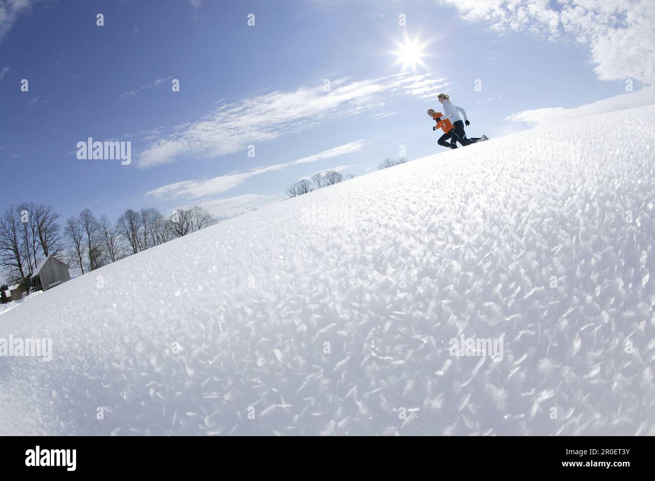 Old man walking through snow hi-res stock photography and images - Alamy