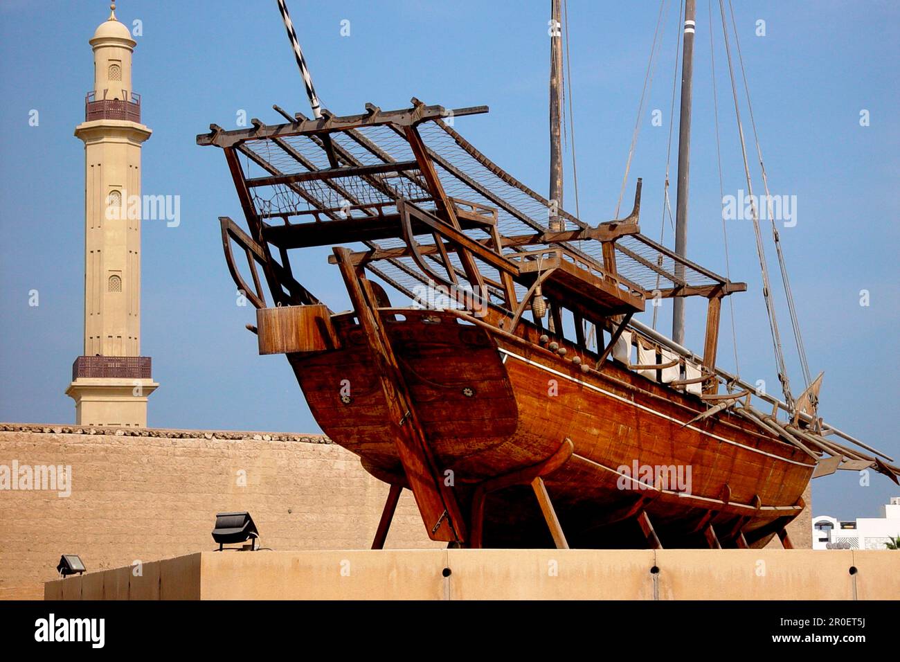 Old ship at Dubai museum and minaret in the sunlight, Dubai, UAE ...