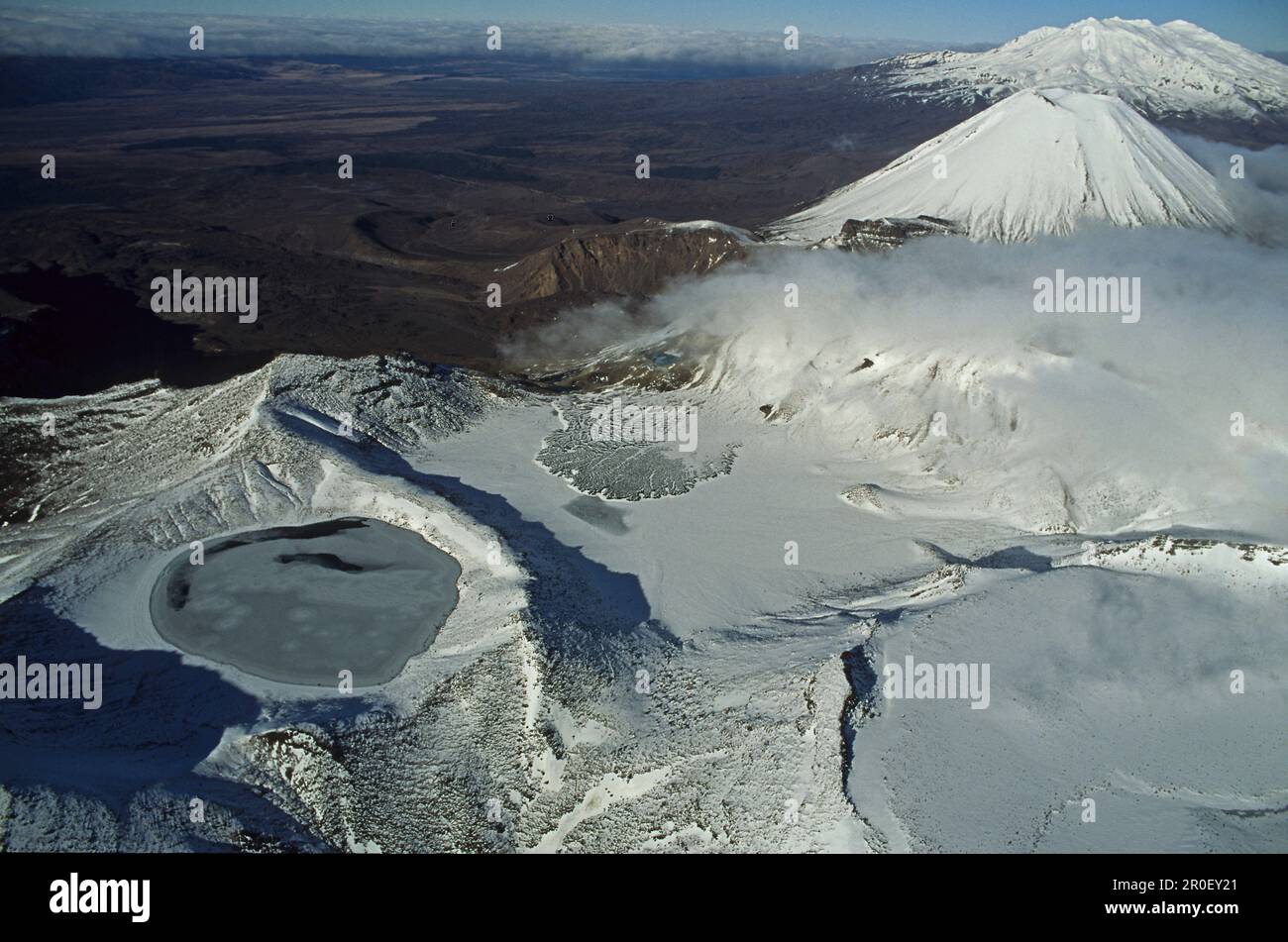 Aerial view of the snow covered volcanos Mount Ruapehu and Mount ... Aerial view of the snow covered volcanos Mount Ruapehu and Mount ...